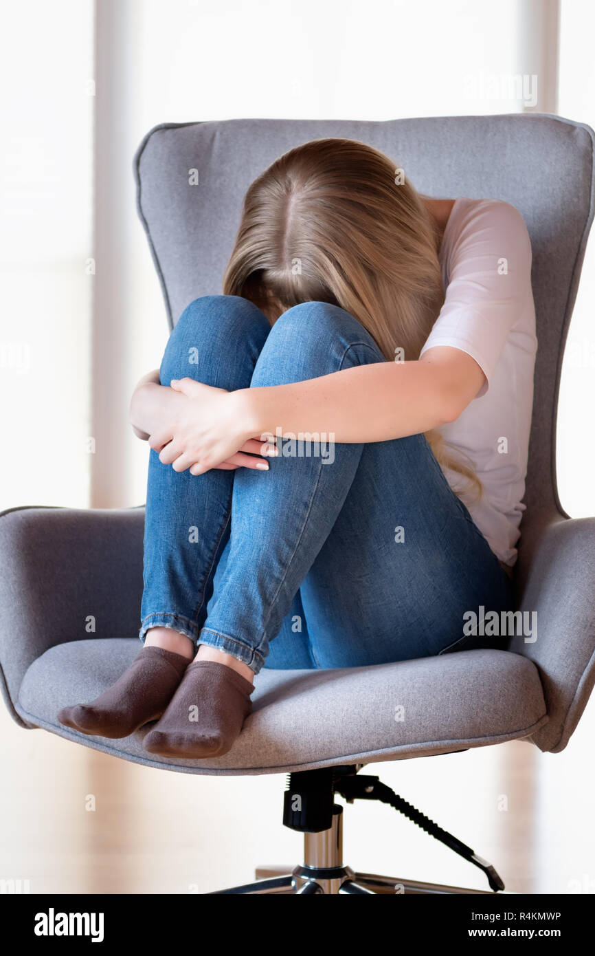 Girl Crying On Chair High Resolution Stock Photography and Images - Alamy