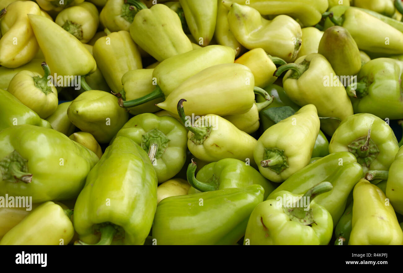 Close up background of fresh green and yellow sweet bell peppers on ...
