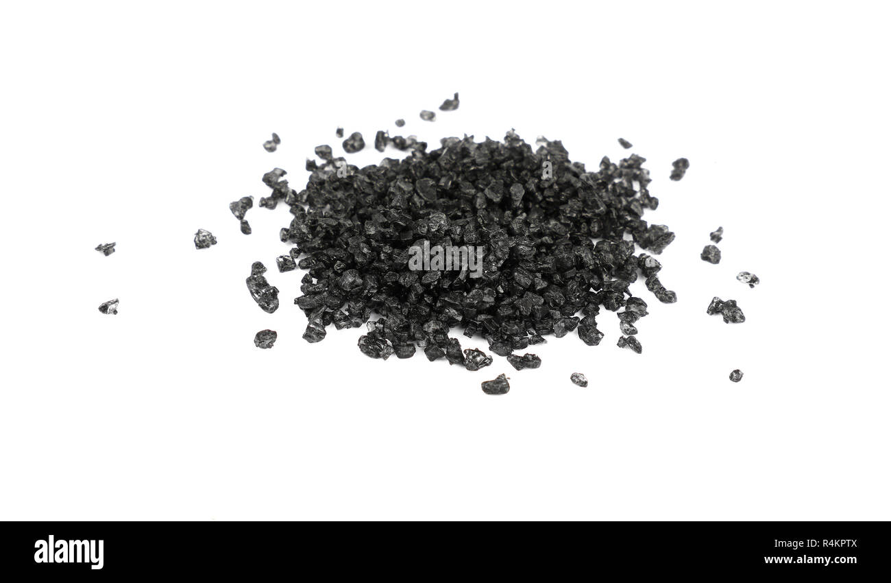 Close up one portion, heap of crystals black volcanic Hawaiian salt ...