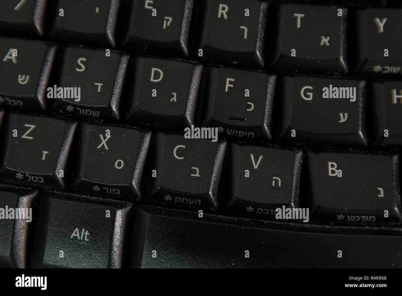 Keyboard with letters in Hebrew and English Stock Photo - Alamy
