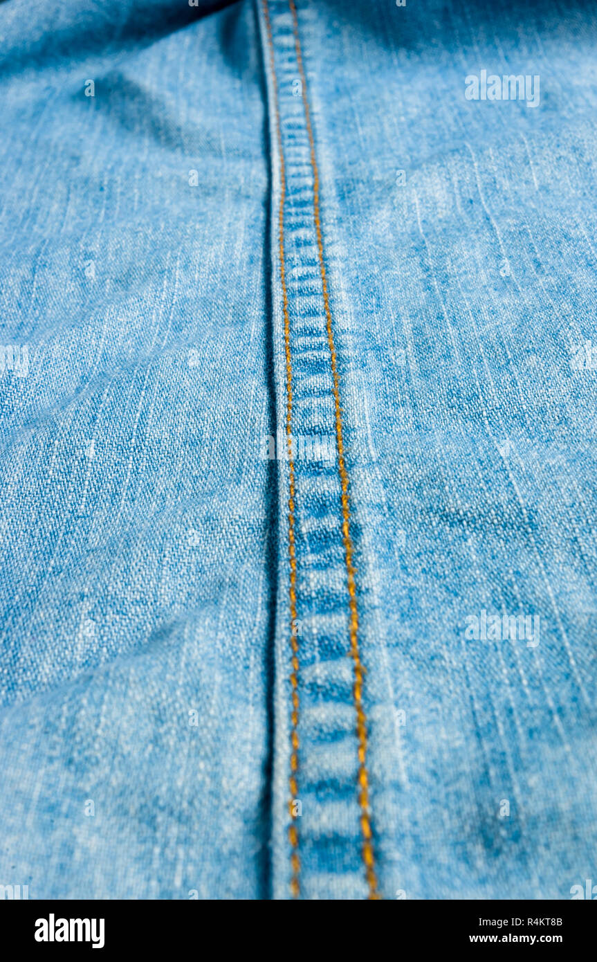 Blue washed faded jeans texture with seams, clothing items, macro ...