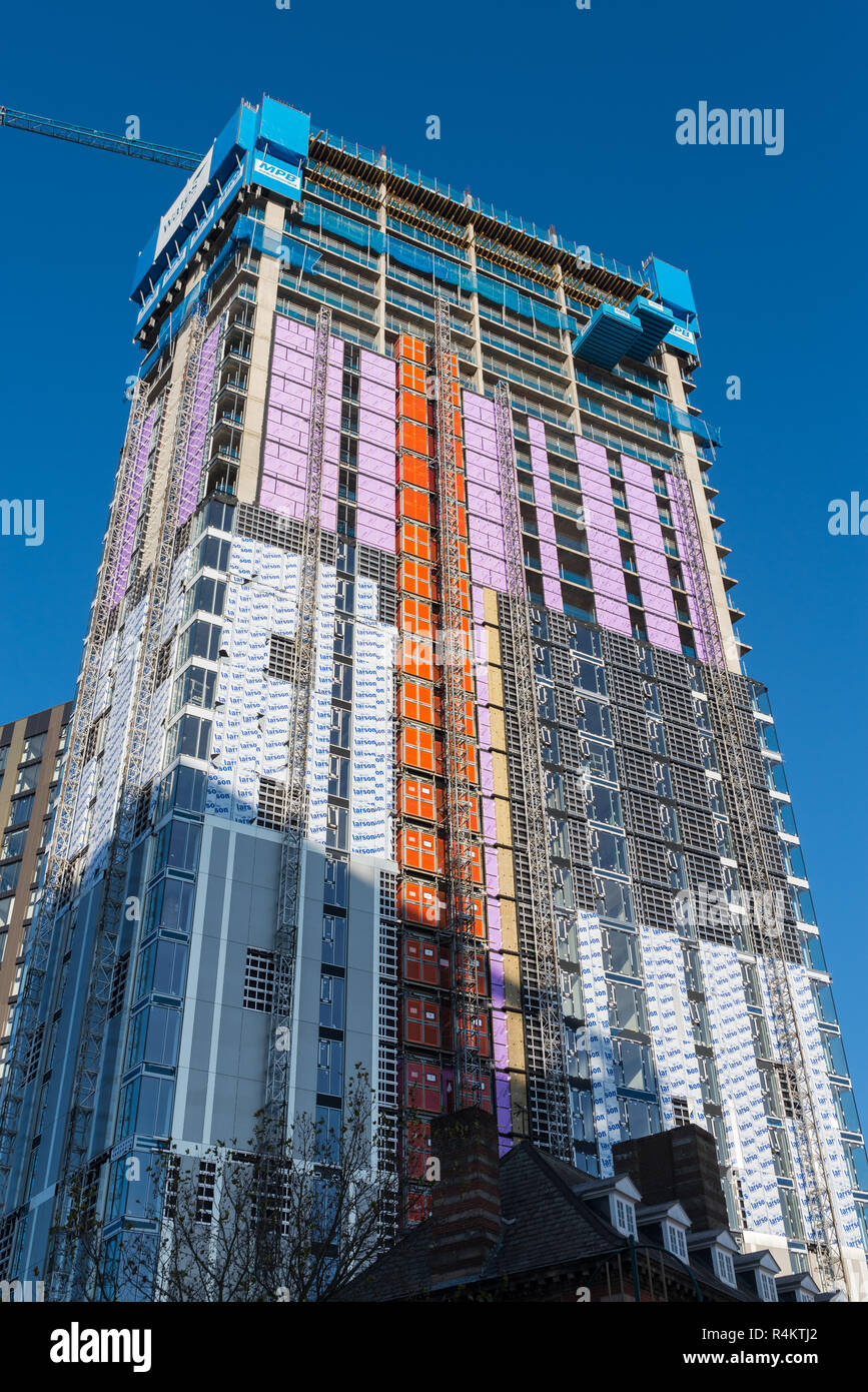 Construction of tall building showing structure and insulation and ...