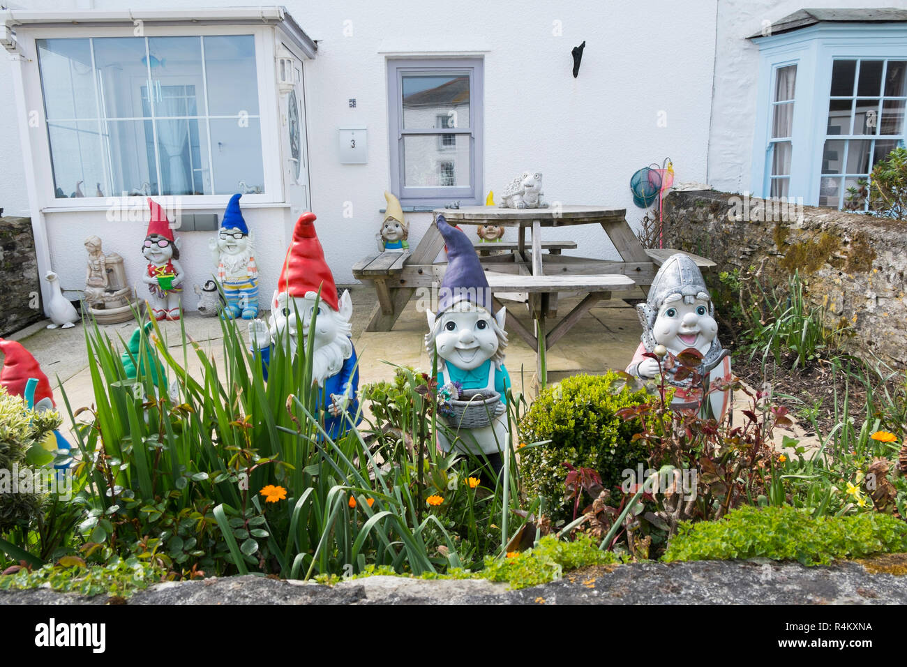 A collection of gnomes in a front garden in Portscatho on the south ...