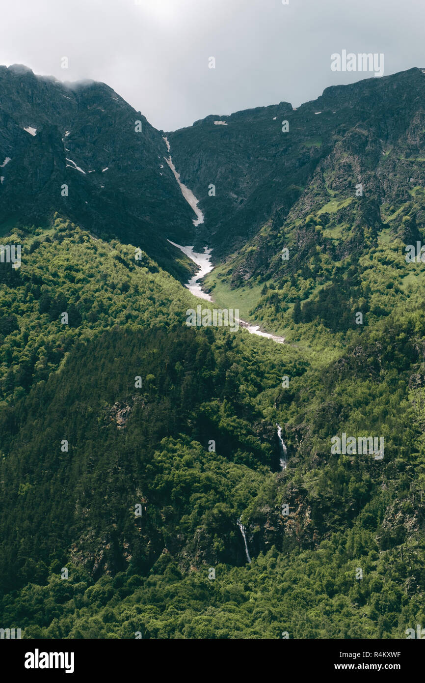 mountain snow becomes river with waterfalls. Highlands landscape Stock ...
