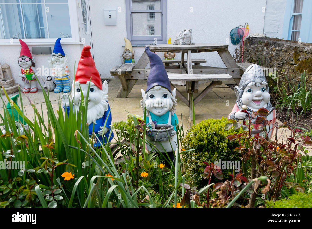 A collection of gnomes in a front garden in Portscatho on the south ...