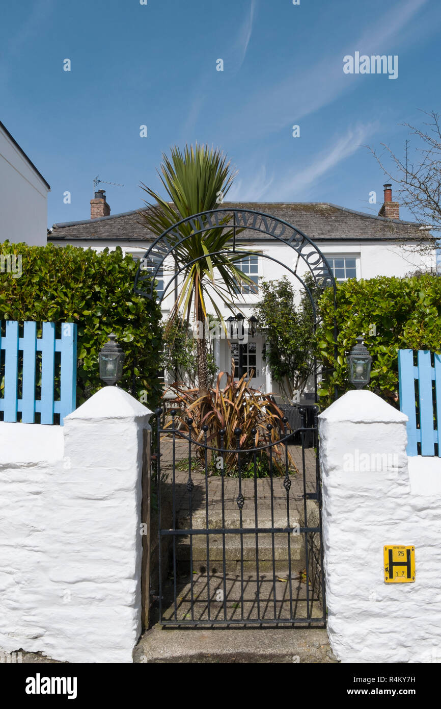 Any Way The Wind Blows written in iron over the gate of a house in ...