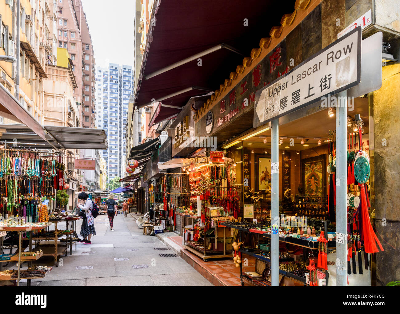 Tourists shopping along Upper Lascar Row, commonly known as Cat St in ...