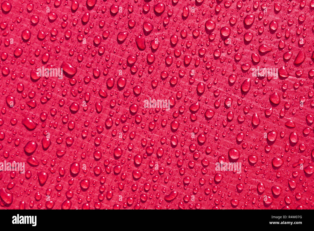 crimson red waterproof material, rip stop cloth with drops of water ...