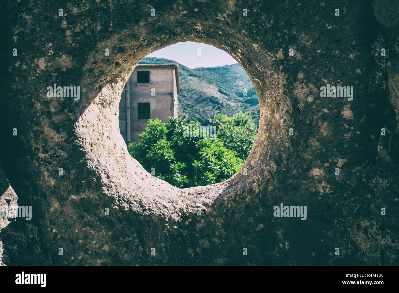 Wallpaper background of a round window of an ancient wall with ...