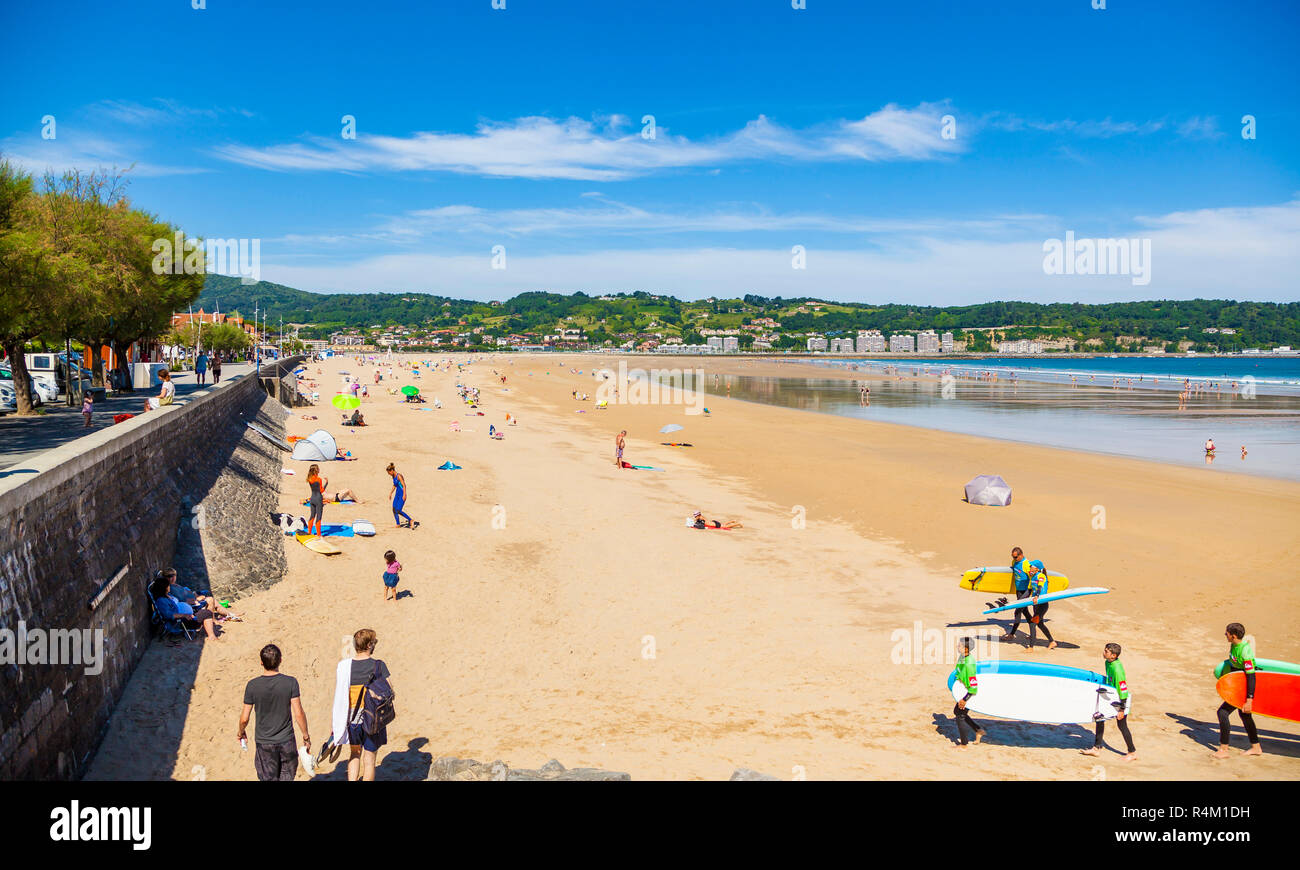 HENDAYE, FRANCE - JUNE 8: Tourists and surfers enjoy the beach of the ...