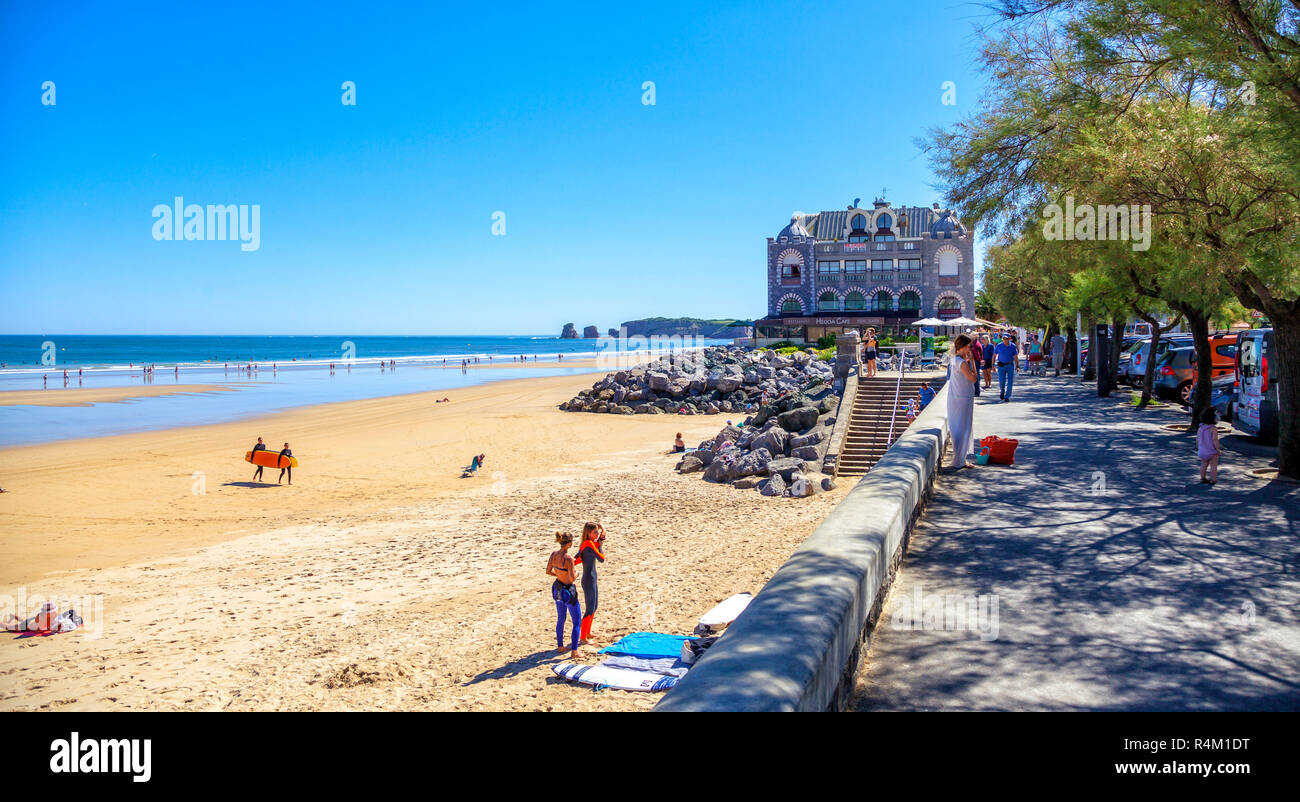HENDAYE, FRANCE - JUNE 8: Tourists and surfers enjoy the beach of the ...