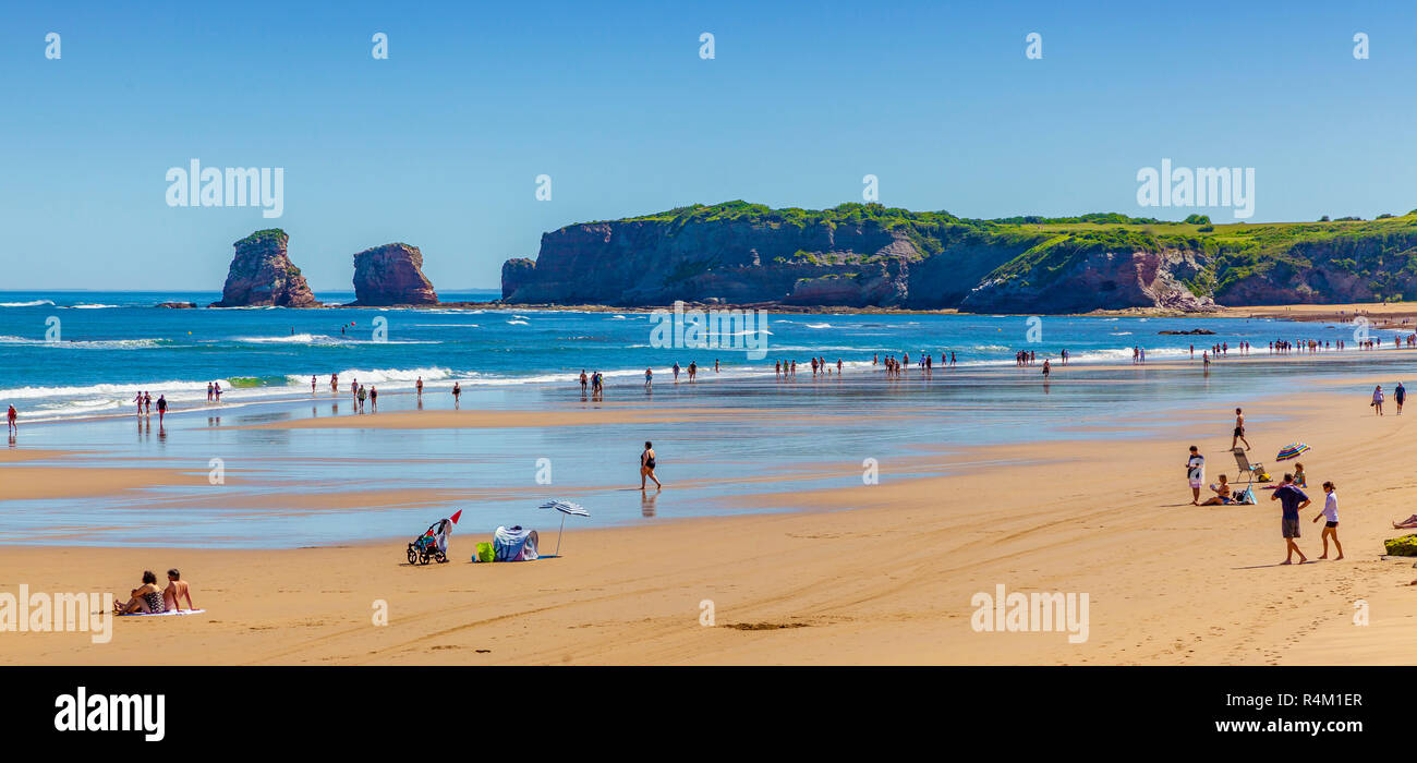 HENDAYE, FRANCE - JUNE 8: Tourists and surfers enjoy the beach of the ...