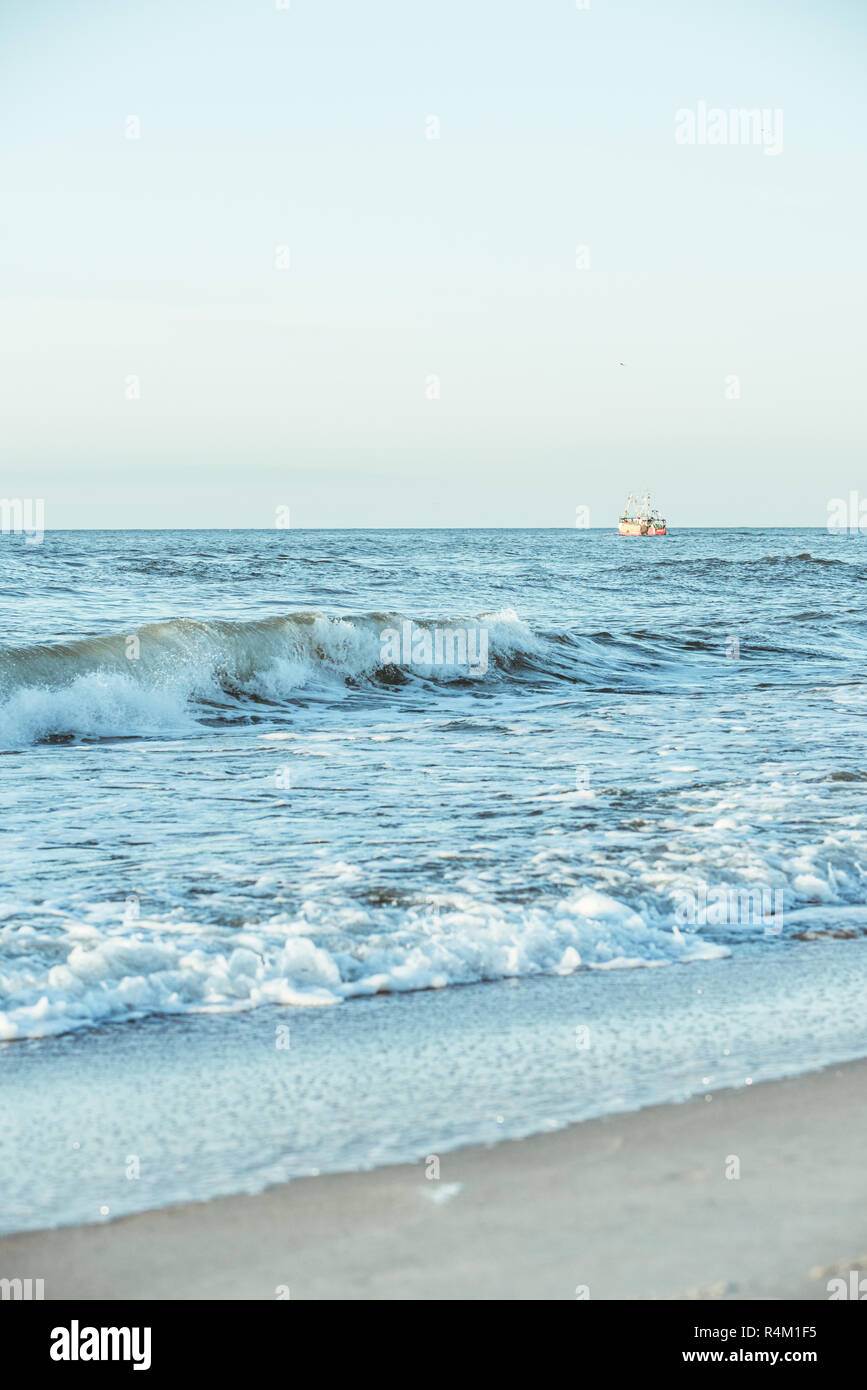 Sea wave breaking Stock Photo - Alamy