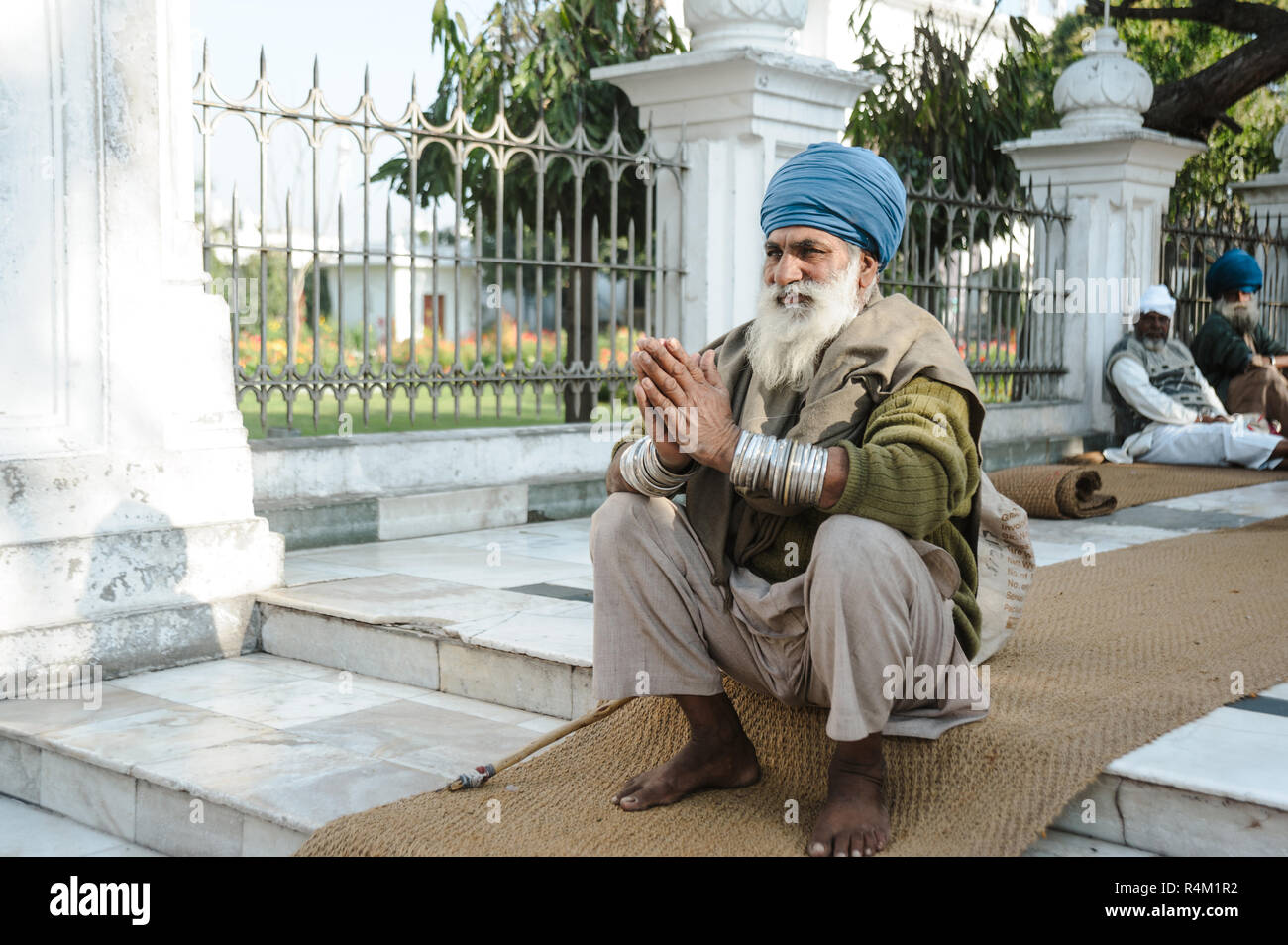 old indian sikh praying nearby golden temple. 26 february 2018 Amritsar ...