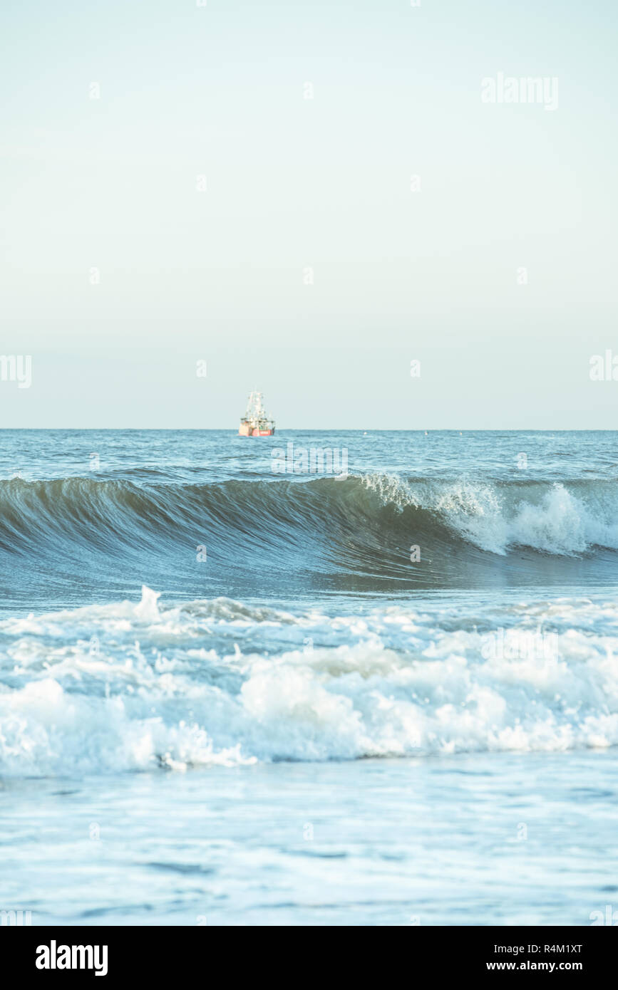 Sea wave breaking Stock Photo - Alamy