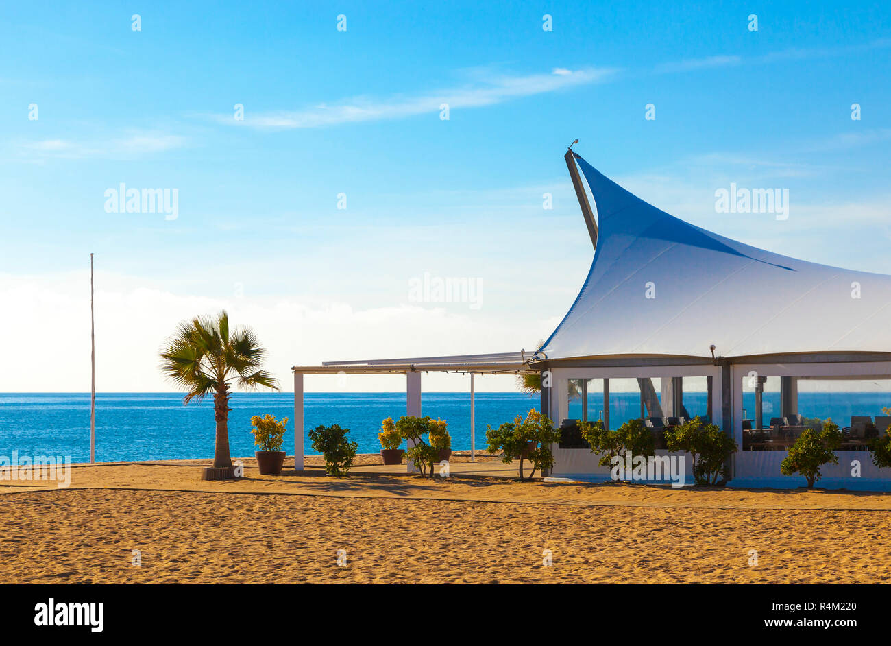 Beach bar overlooking the blue sea Stock Photo - Alamy