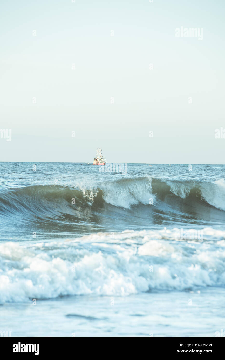 Sea wave breaking Stock Photo - Alamy