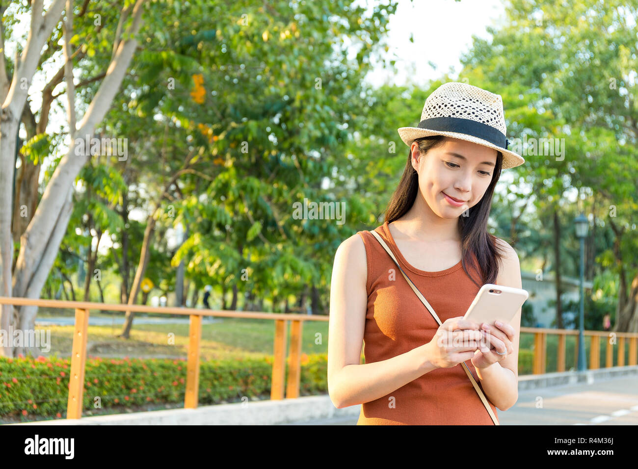 Woman working on mobile phone Stock Photo - Alamy
