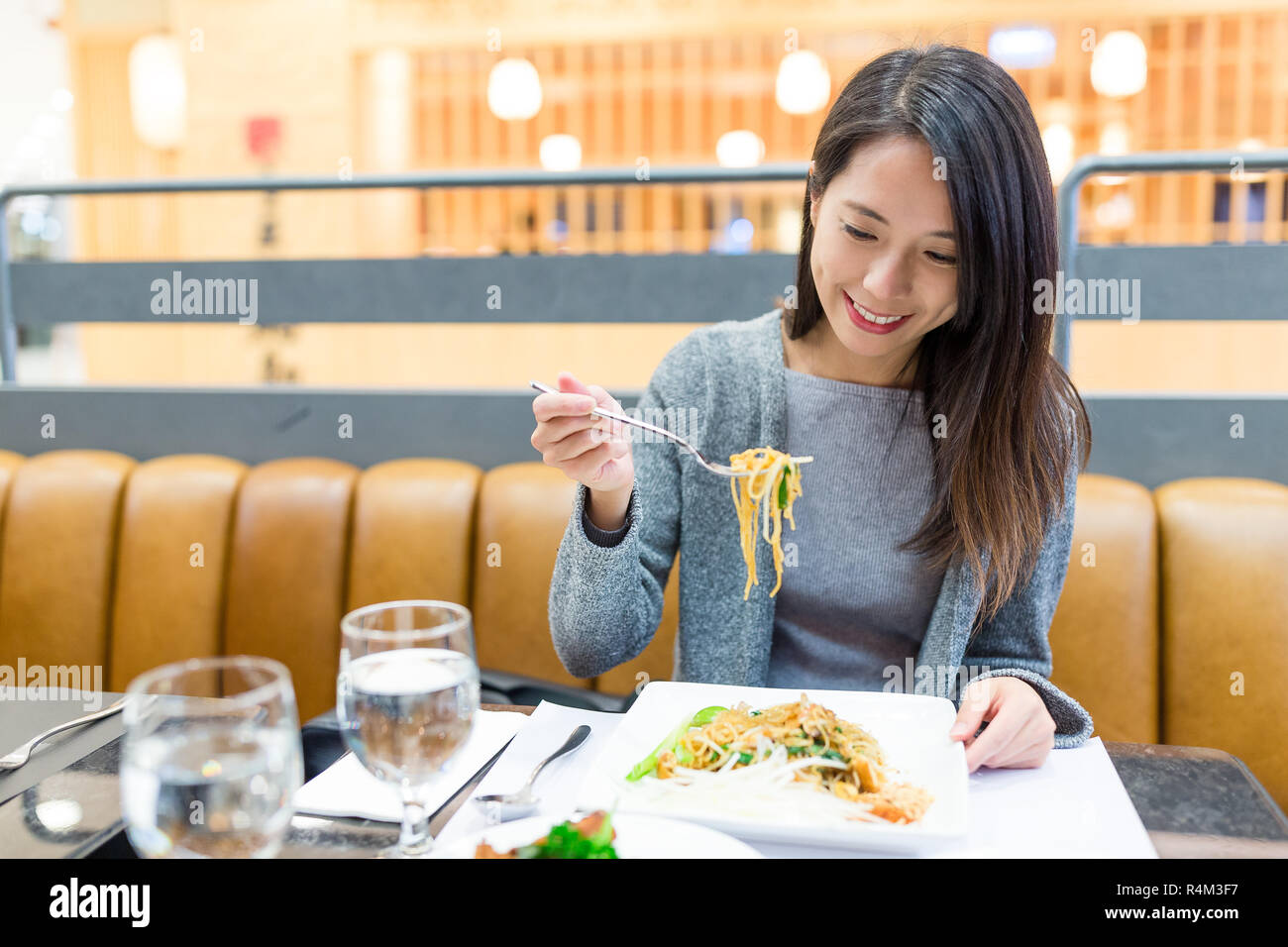 Woman enjoy dinner in restaurant Stock Photo - Alamy