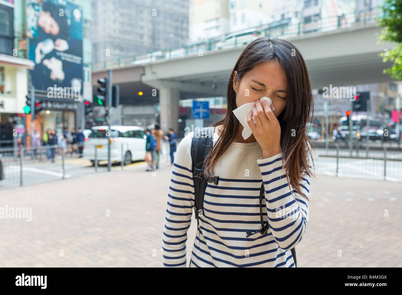 Woman sneezing in outdoor street hi-res stock photography and images ...