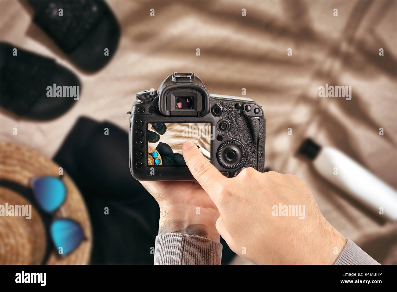 Digital single-lens reflex camera in hands. Photographer shooting hands ...