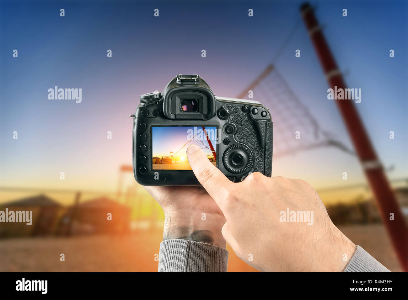 Digital single-lens reflex camera in hands. Photographer shooting hands ...