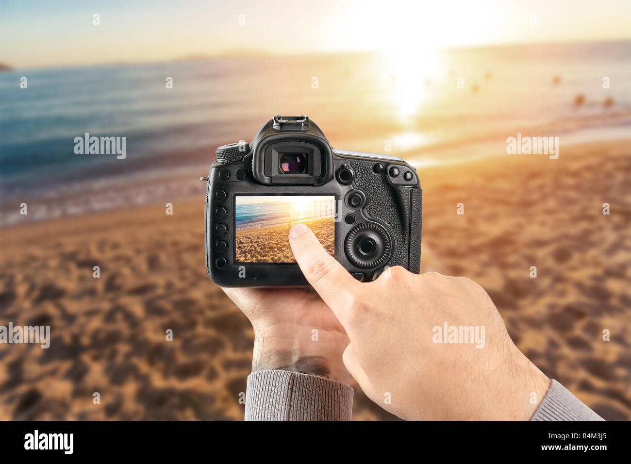 Digital single-lens reflex camera in hands. Photographer shooting hands ...