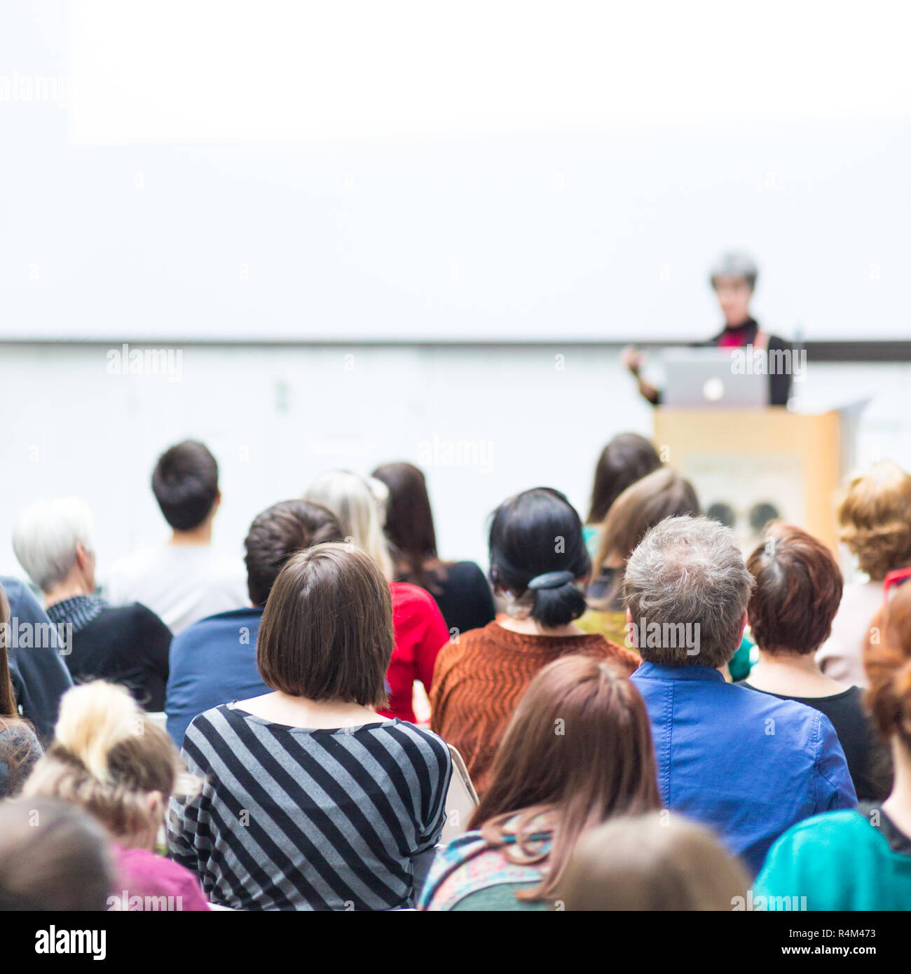 Woman giving presentation on business conference Stock Photo - Alamy