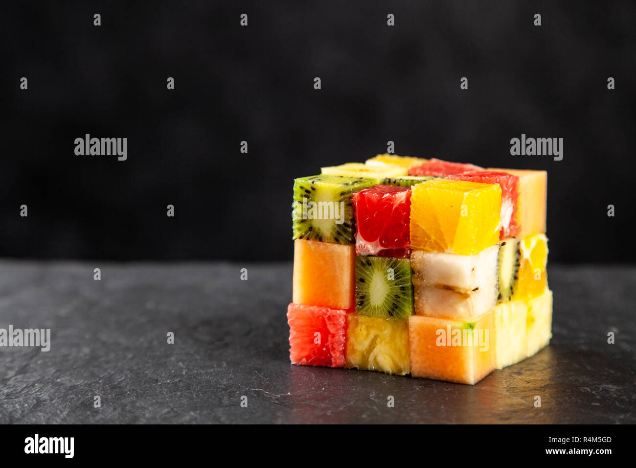 Fruit cube isolated on white background Stock Photo - Alamy