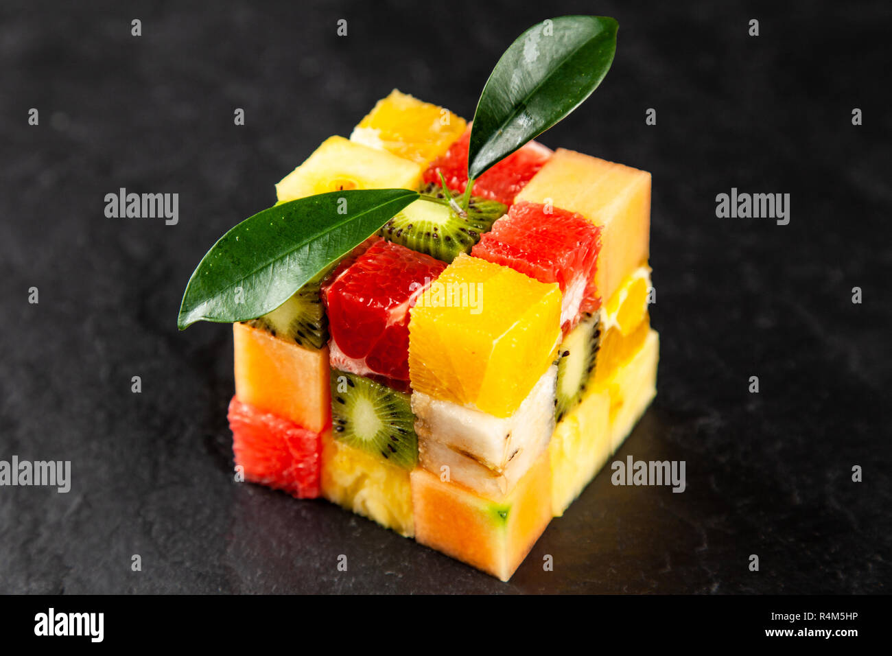 Fruit cube isolated on white background Stock Photo - Alamy