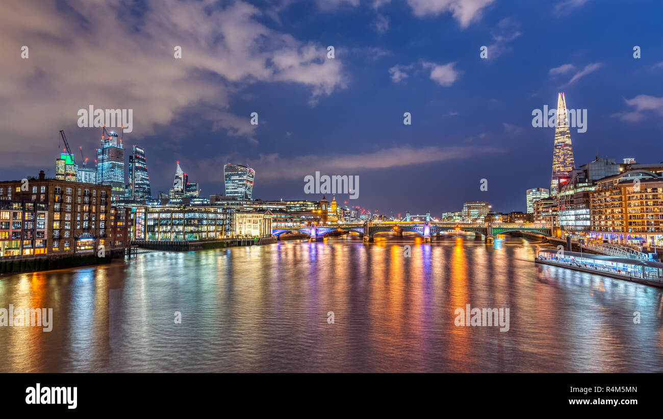 The City of London and the river Thames at night Stock Photo - Alamy