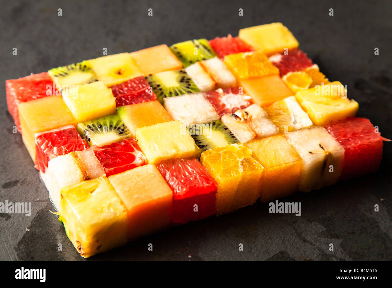 Fruit cube isolated on white background Stock Photo - Alamy