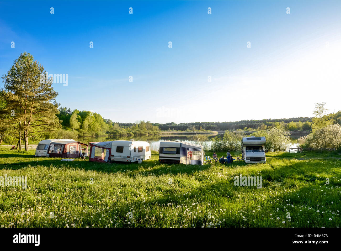 Caravans and camping on the lake. Family vacation outdoors, travel ...