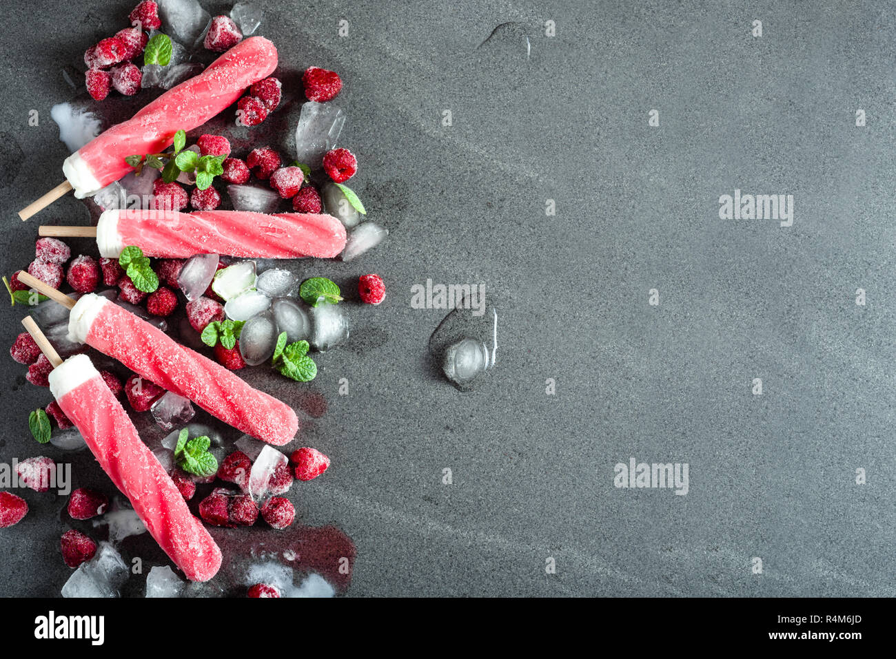 Red ice lolly with summer fruit, cold refreshing snack Stock Photo - Alamy