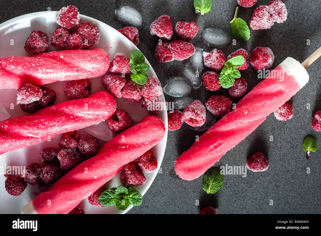 Red ice lolly with summer fruit, cold refreshing snack Stock Photo - Alamy