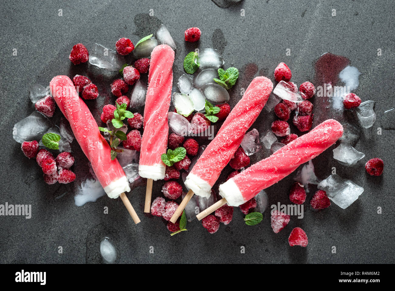 Red ice lolly with summer fruit, cold refreshing snack Stock Photo - Alamy
