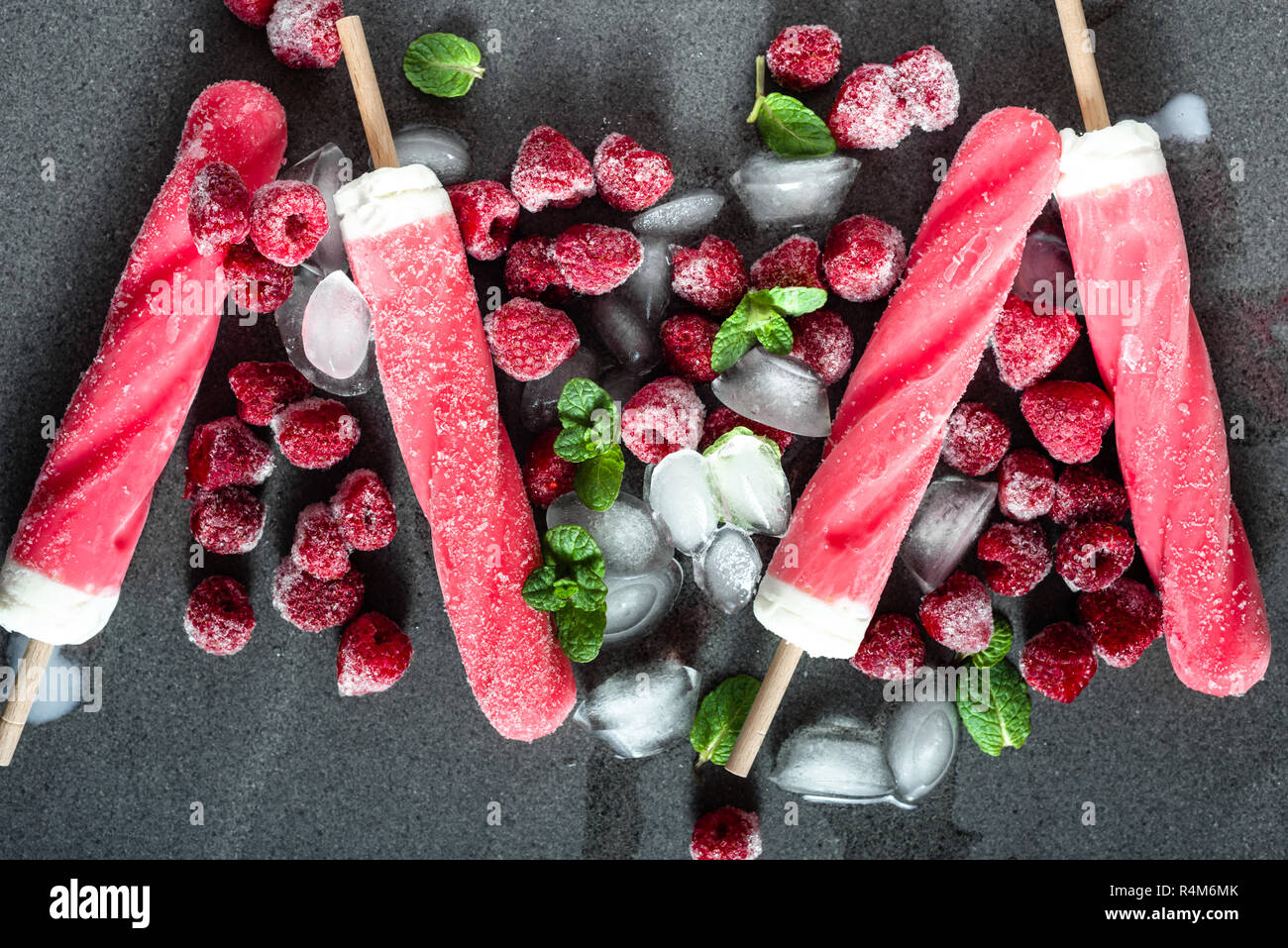 Red ice lolly with summer fruit, cold refreshing snack Stock Photo - Alamy