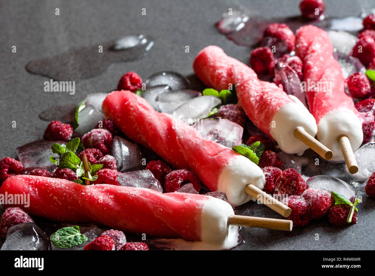 Red ice lolly with summer fruit, cold refreshing snack Stock Photo - Alamy