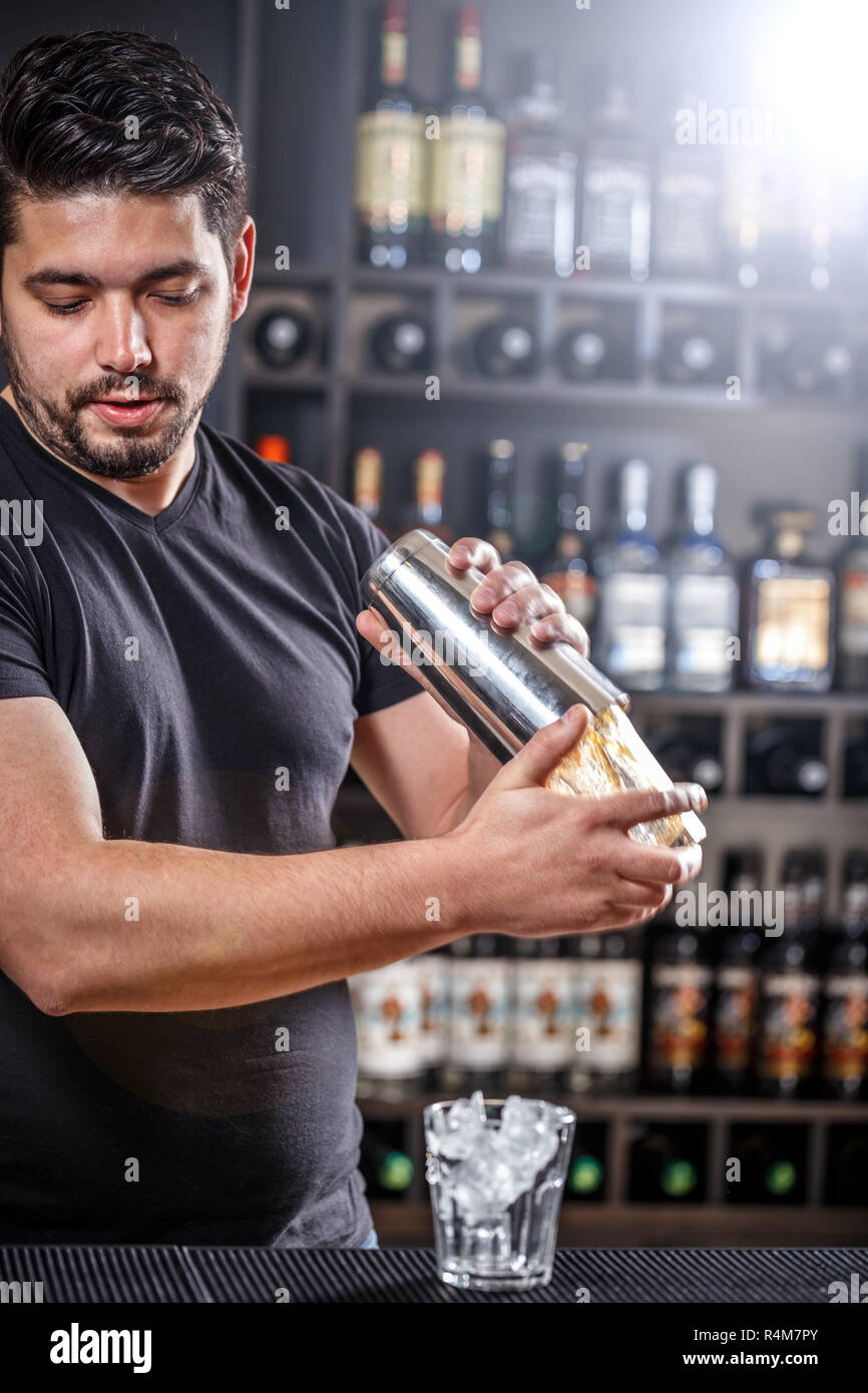 Young bartender cocktail shaking drinks hi-res stock photography and ...