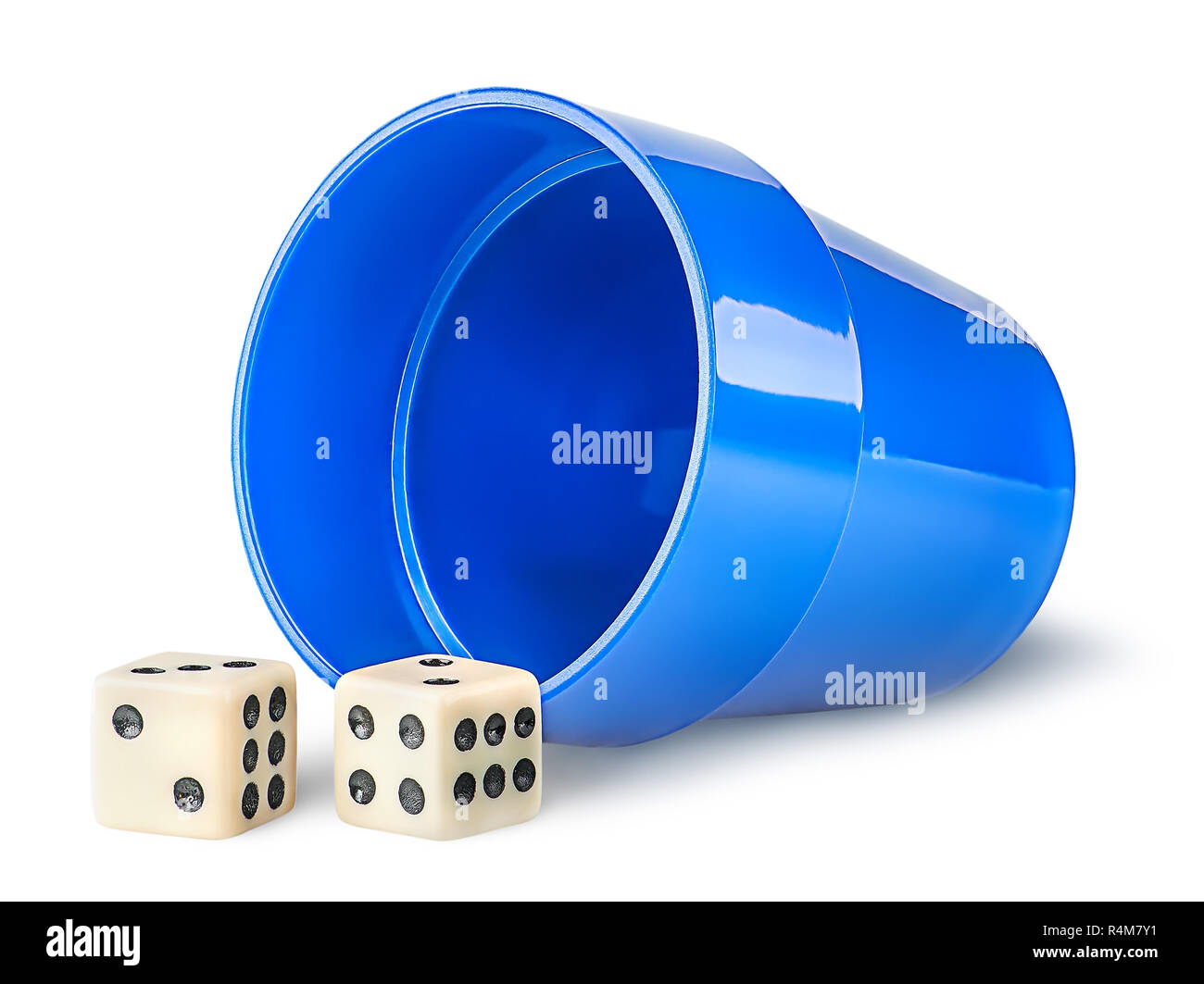 Gaming dice and cup Stock Photo - Alamy