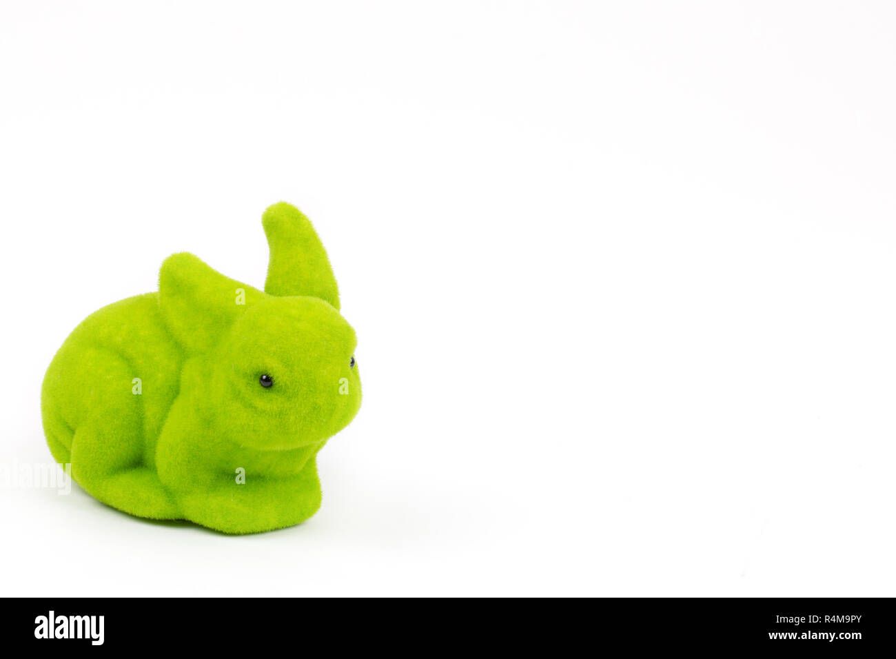 Green rabbit on a white background Stock Photo - Alamy