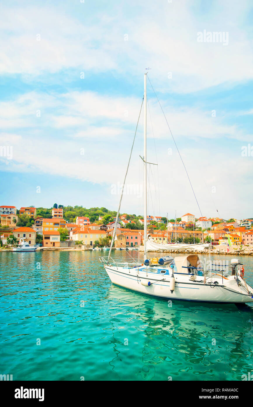 white yacht moored in beautiful small marina at Sali port on Dugi ...