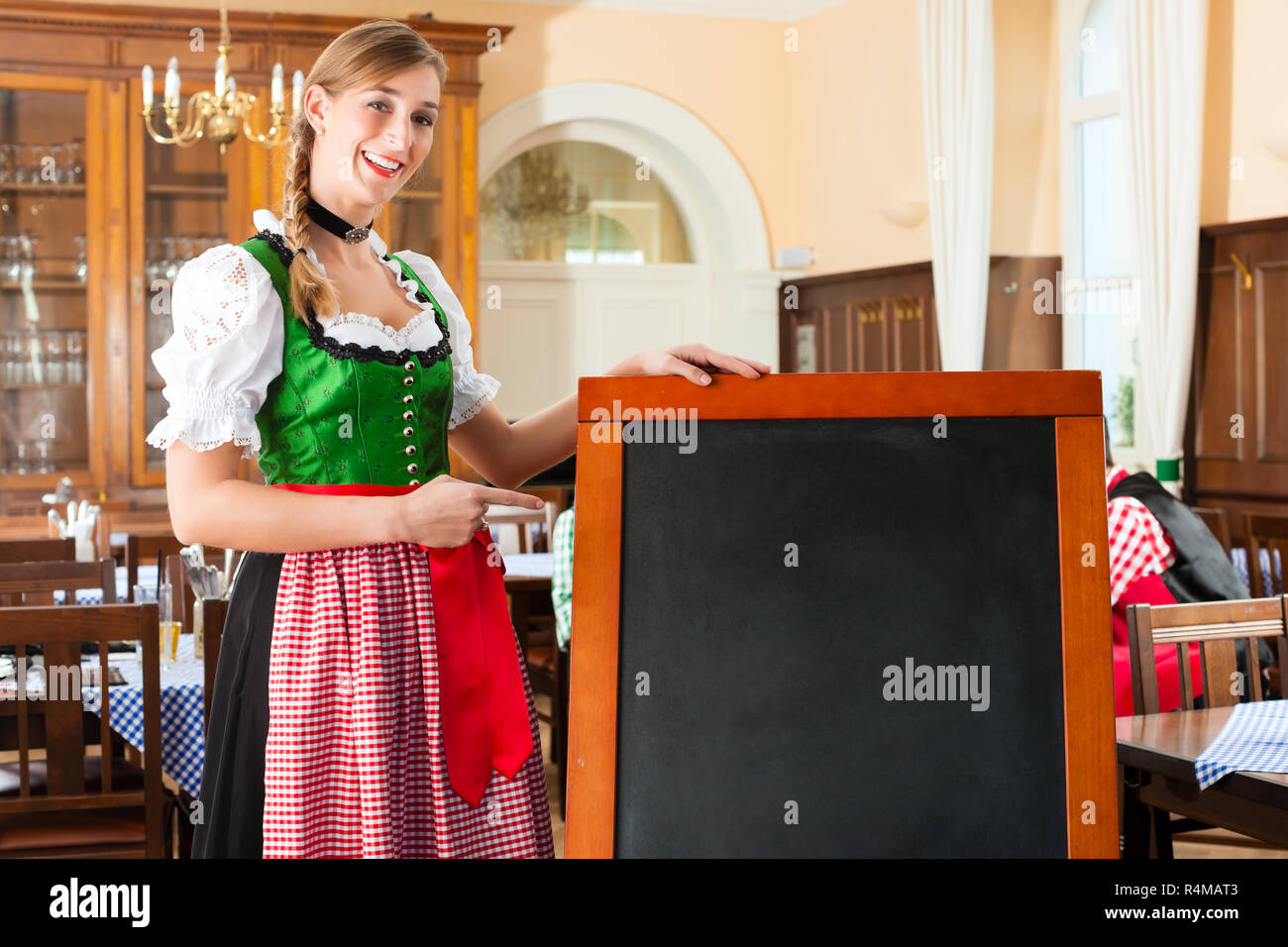 Female Innkeeper in traditional Bavarian clothes in pub Stock Photo - Alamy