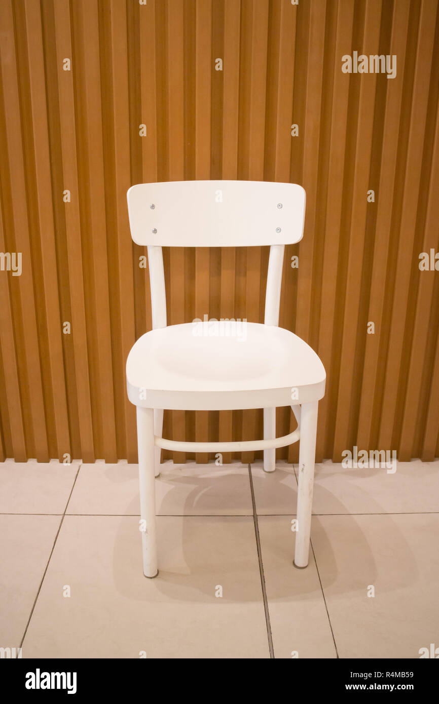 Single Wooden Chair In Minimal Room Style Stock Photo - Alamy