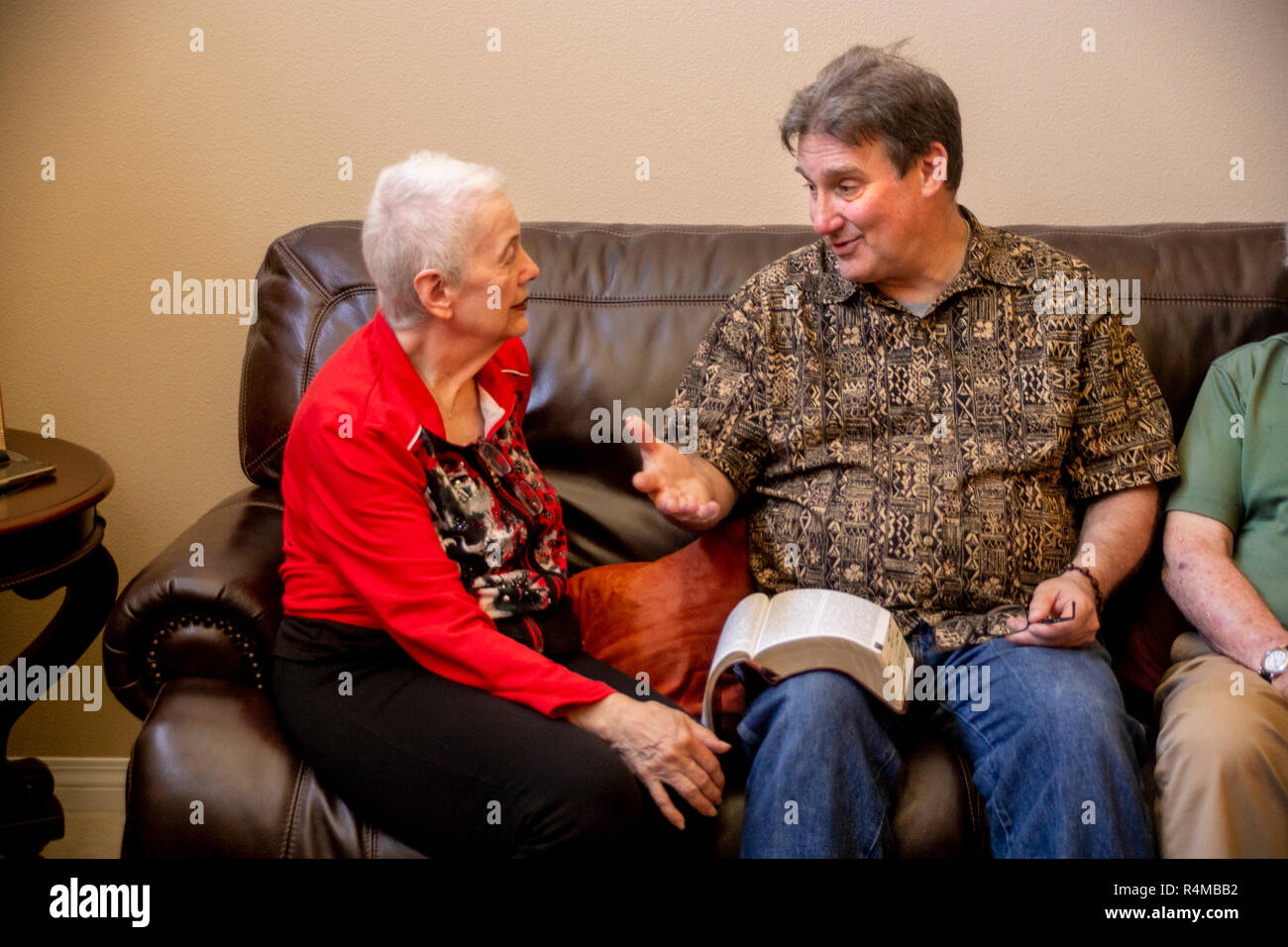 A Catholic deacon visits a handicapped parishioner unable to attend ...