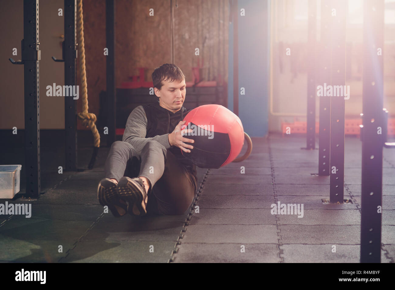 Athletic man doing abdomen exercise on the floor. Man doing workout ...