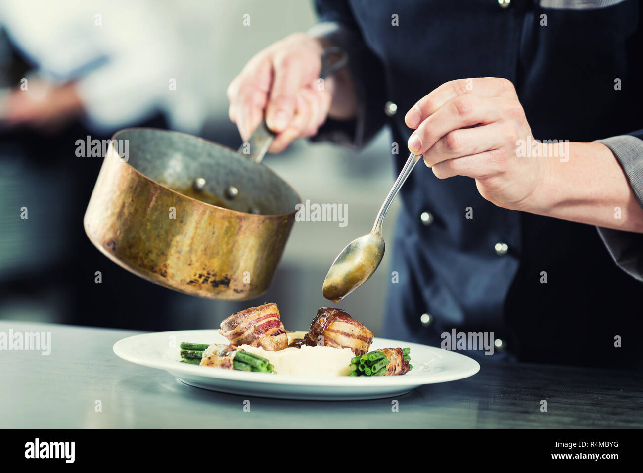 Caucasian male chef pouring sauce hi-res stock photography and images ...