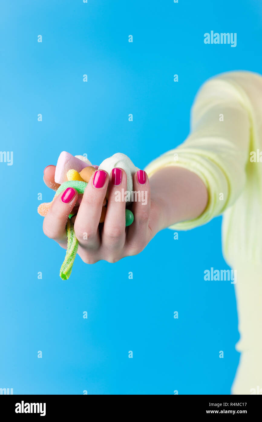 Girl with sweet goodies and candy Stock Photo - Alamy