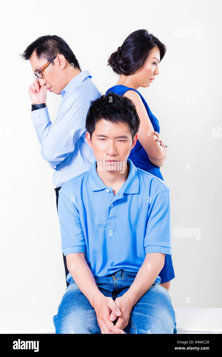 Young Chinese boy suffering from parents divorce Stock Photo - Alamy