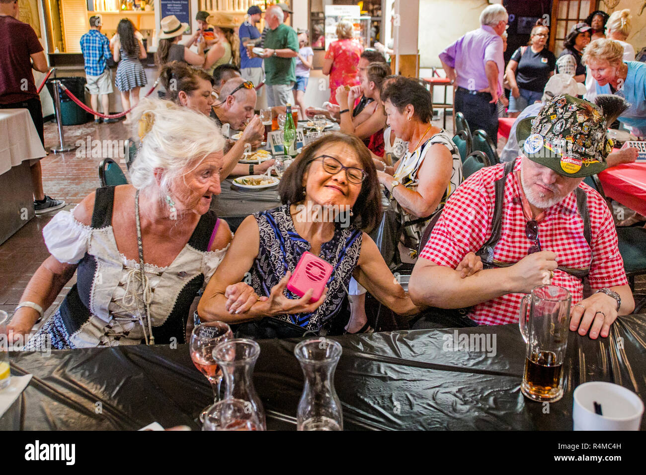 Elderly diners happily sway to the music of a German band at an ...